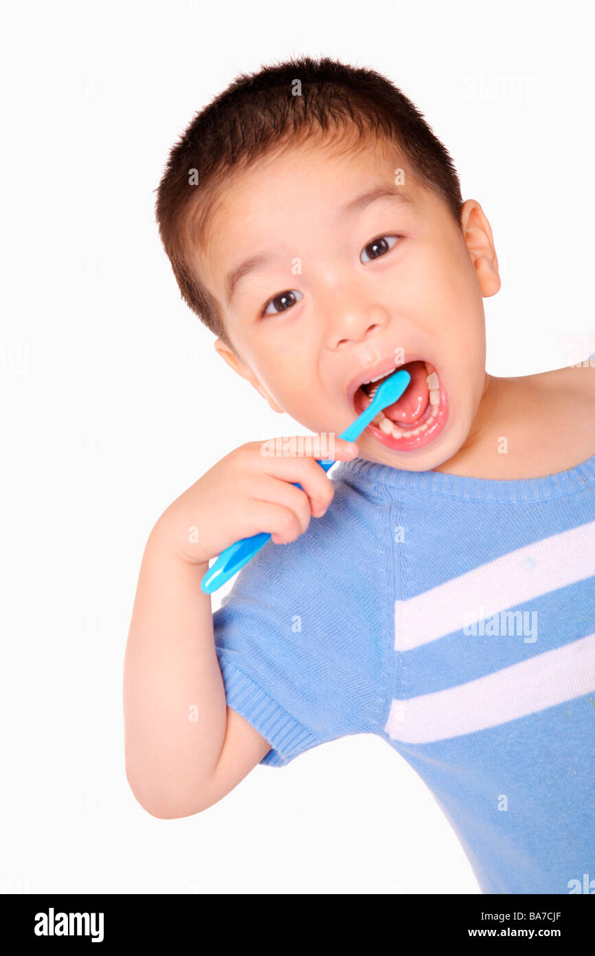 Boy brushing teeth portrait Stock Photo - Alamy