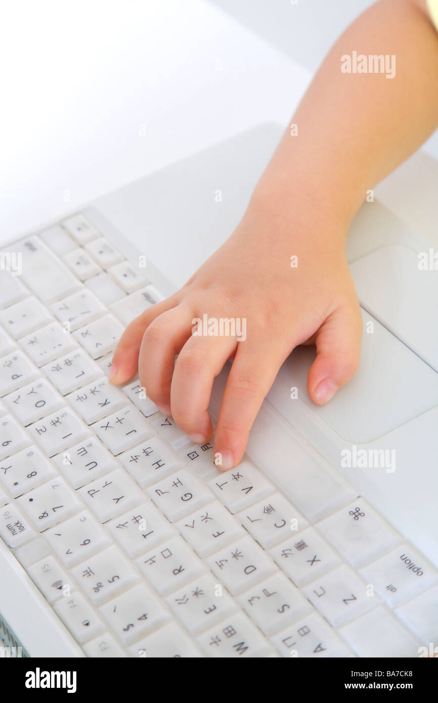 Baby touching laptop keyboard hi-res stock photography and images - Alamy
