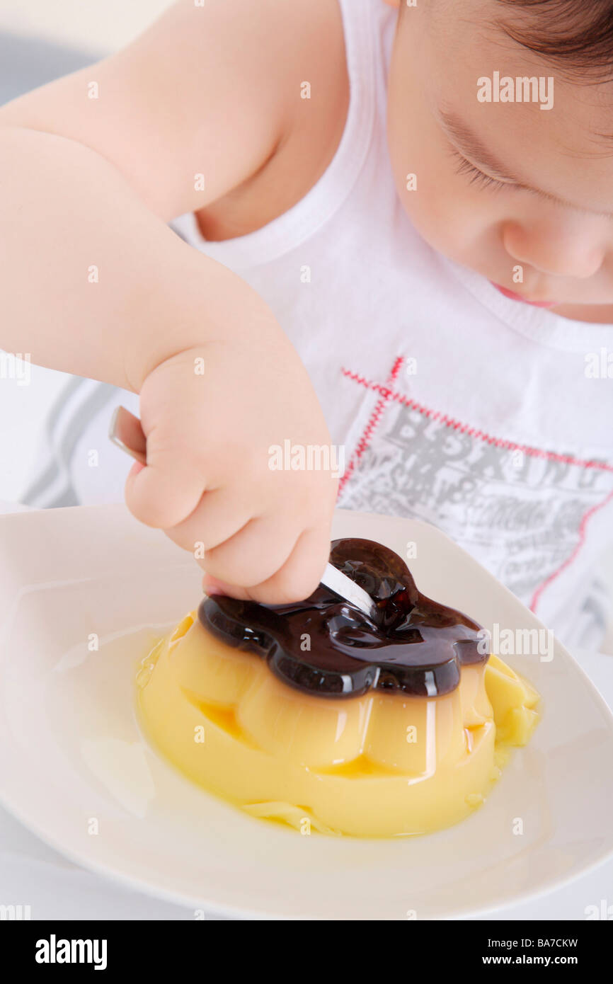 Baby boy with cake Stock Photo - Alamy
