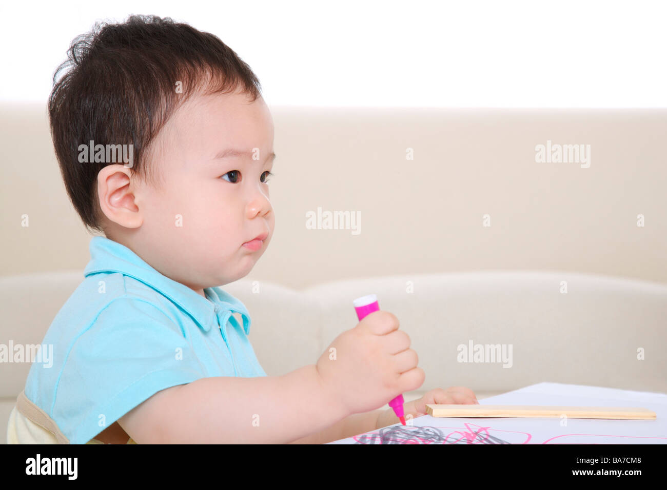 Boy holding pen on hi-res stock photography and images - Alamy