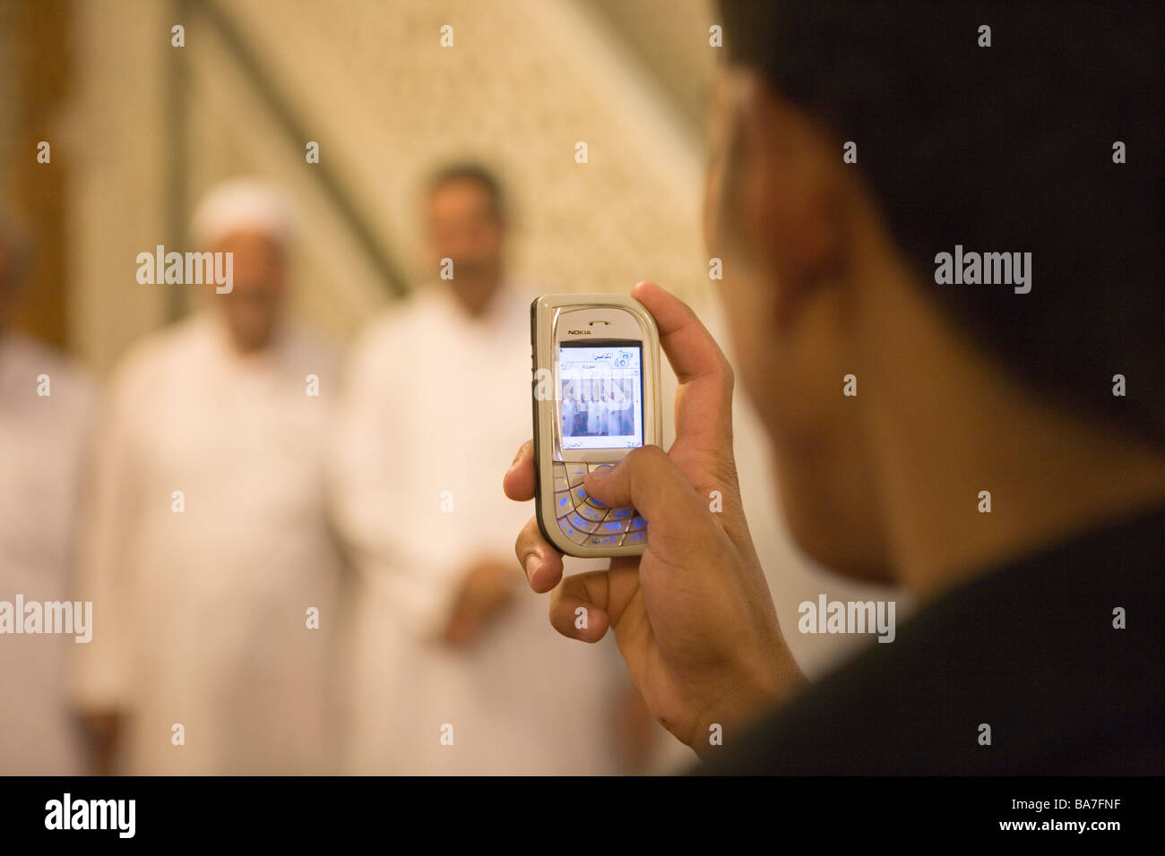 Man taking a photograph of friends with his mobile phone, Mobile Phone ...