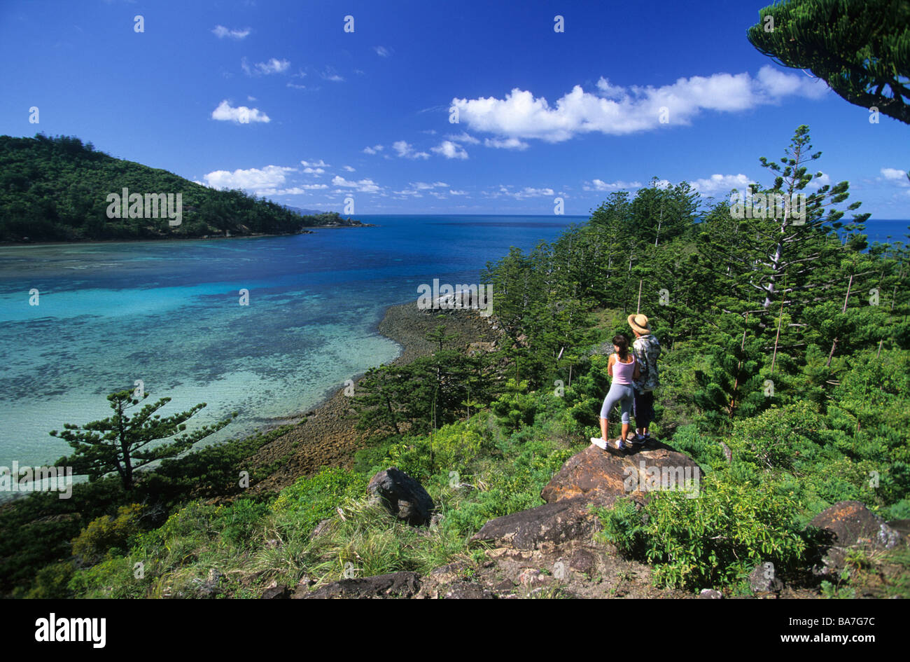 People enjoying the view over Dinghy Bay on Brampton Island, Whitsunday ...