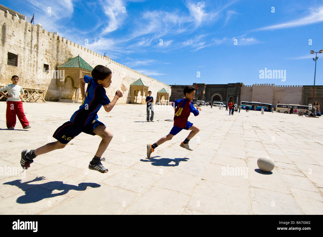Boys playing football on a market square in Meknes, Marocco, Africa ...