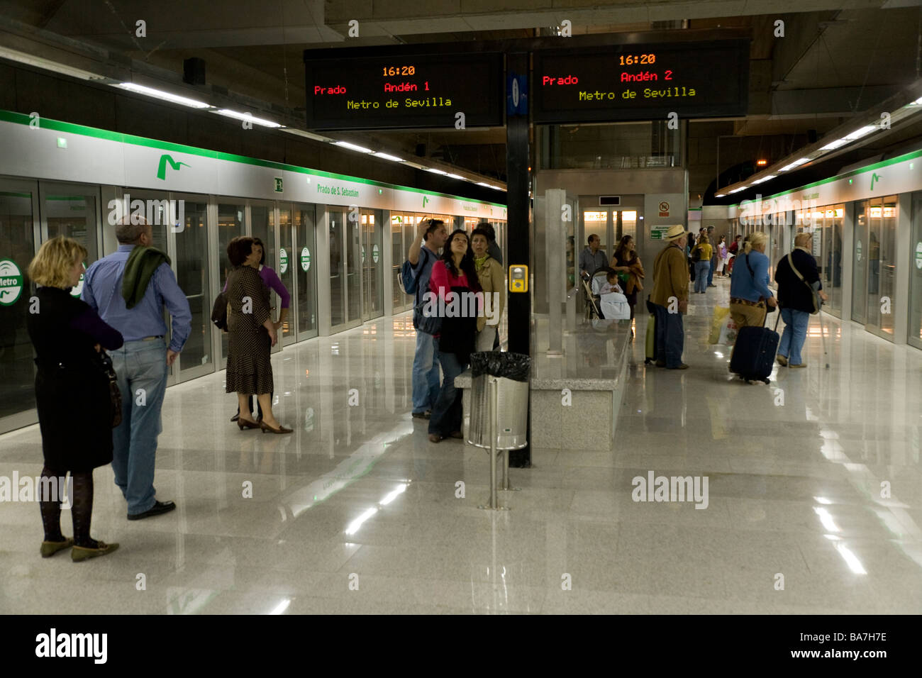 Prado de San Sebastian station platforms with waiting passengers ...