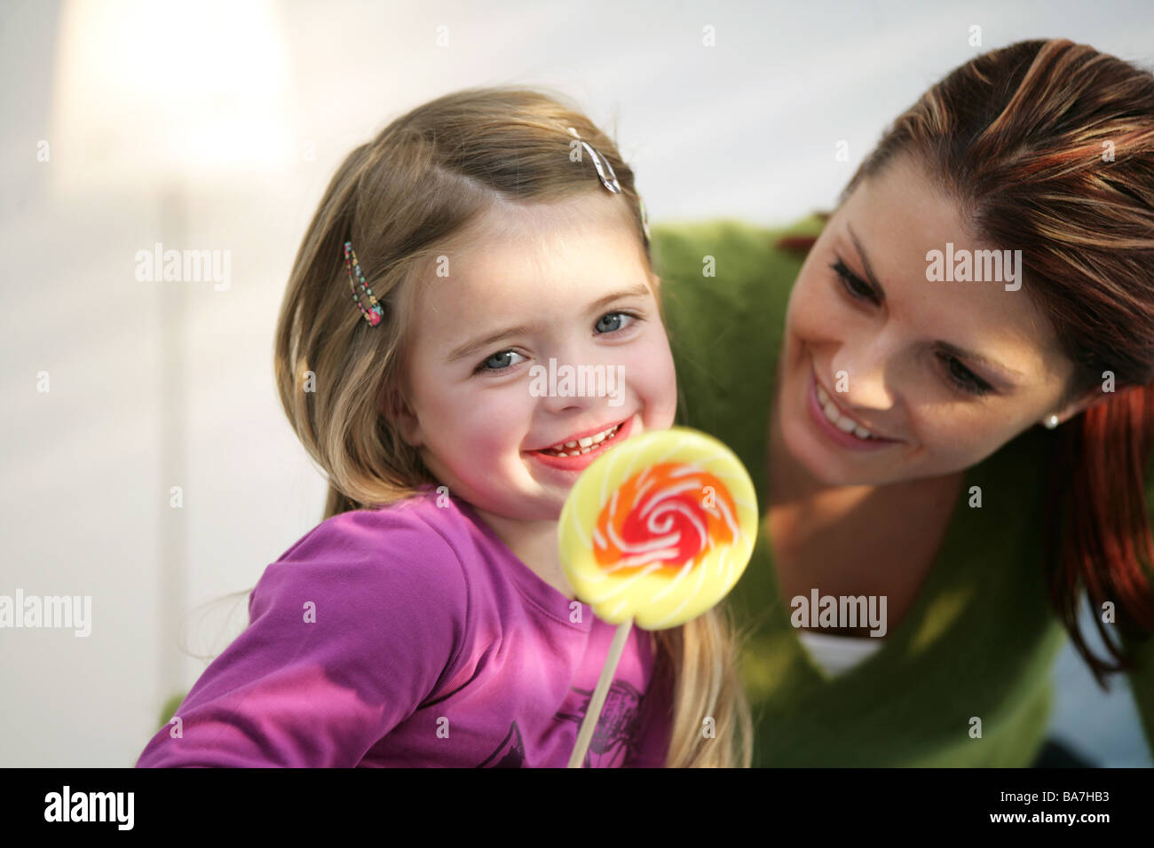 Girl (3-4 years) holding a lollipop, Munich, Germany Stock Photo - Alamy