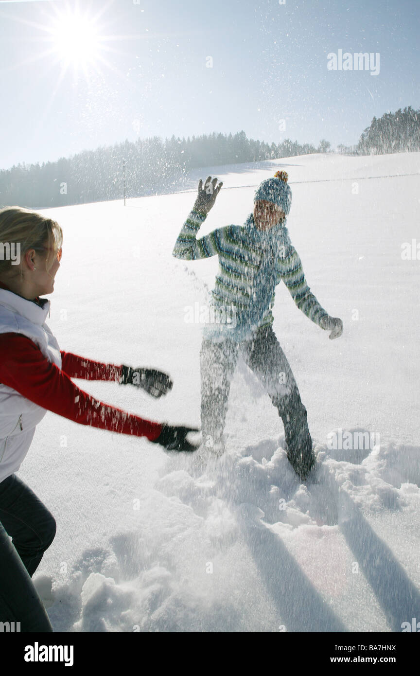 Two women snowball fighting, Styria, Austria Stock Photo - Alamy