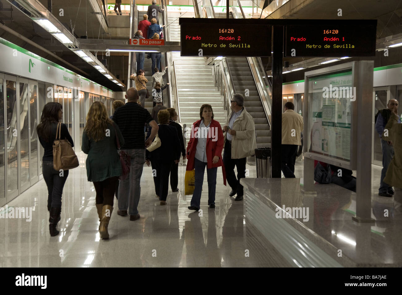 Prado de San Sebastian station platforms with passengers. Seville metro ...
