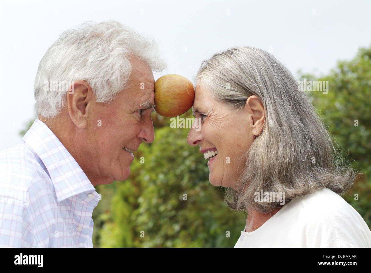 Garden senior-pair opposite forehead apple side-portrait laughs series ...