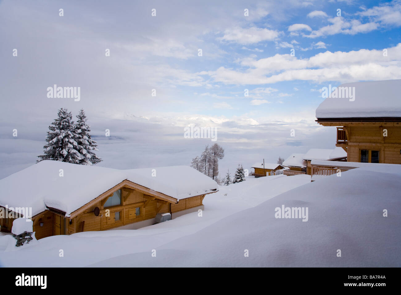 Traditional alpine chalets in snow hi-res stock photography and images ...