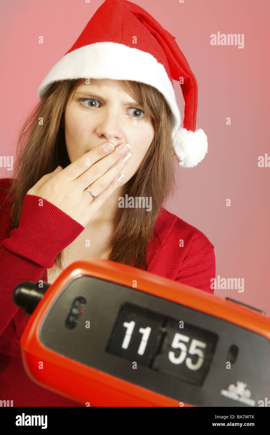 Woman young Nikolaus-cap gesture alarm clocks startled five before ...