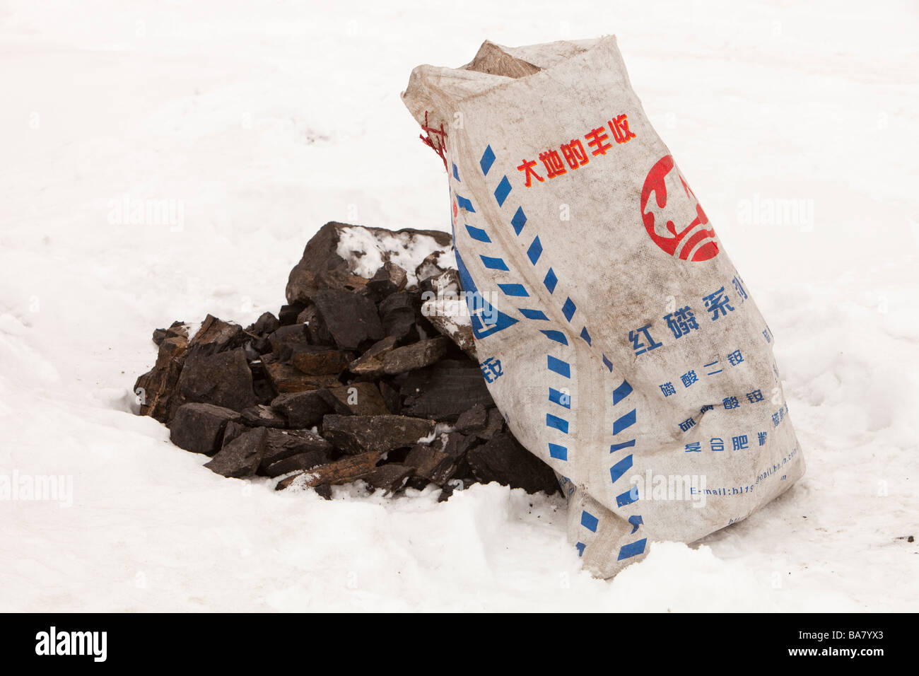 peasants bagging coal from an open cast coal mine near Heihe on the ...