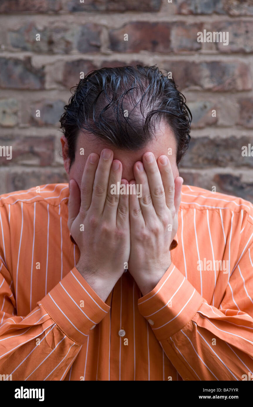 Man head in hands crying Stock Photo - Alamy