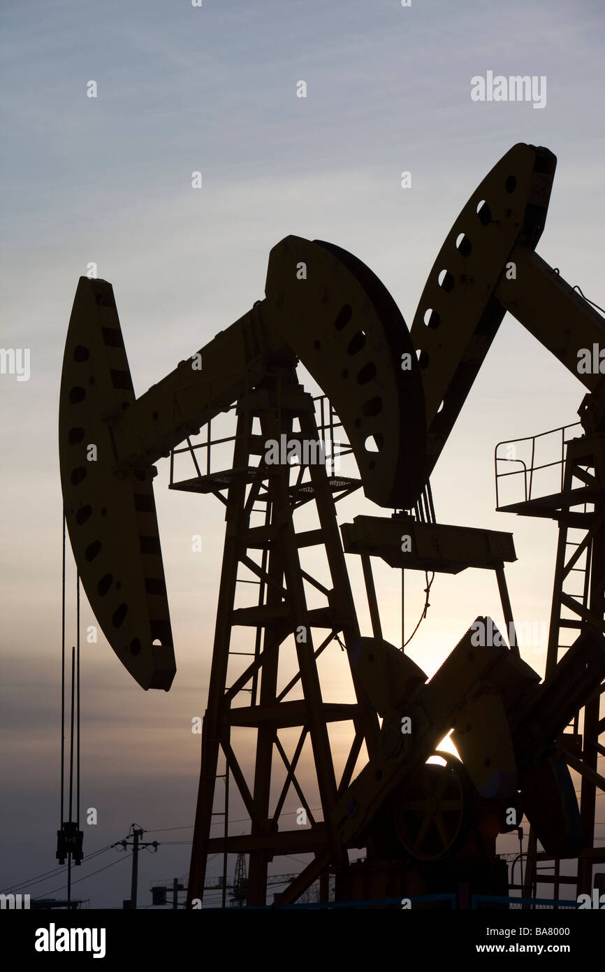 Nodding donkey oil pumps in the Daqing oil field in northern China ...