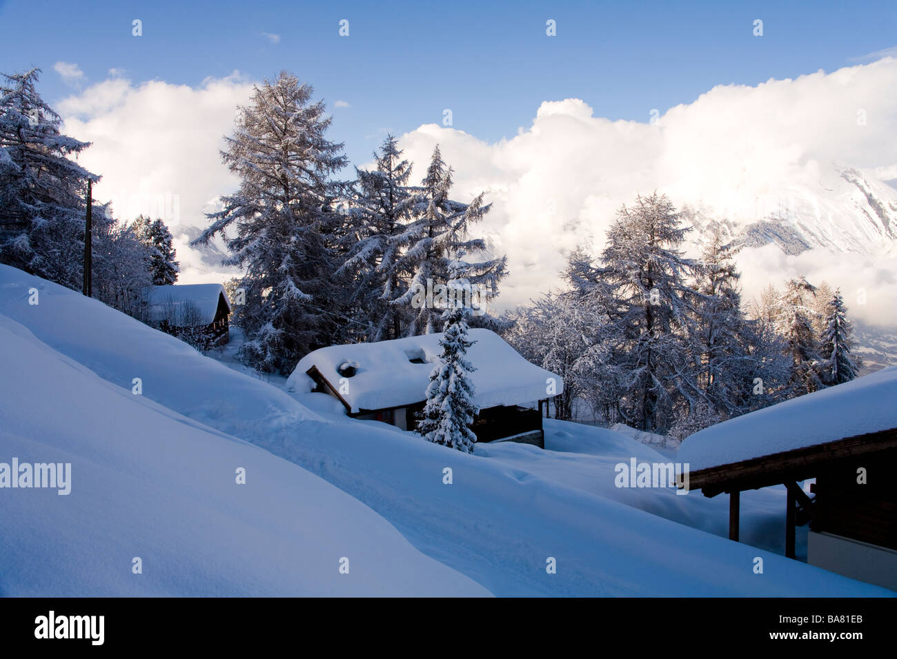 Winter scene of snow covered ski chalets in an Alpine ski resort Stock ...
