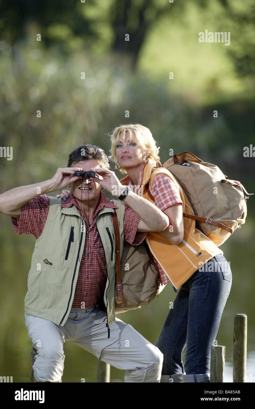 Mate hiking shores bridge man gaze binoculars 50-60 years 60-70 years ...
