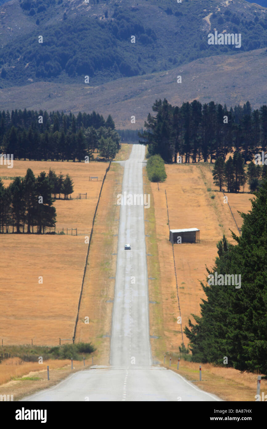 Centre line of empty long straight State Highway 83 road in NZ Stock ...