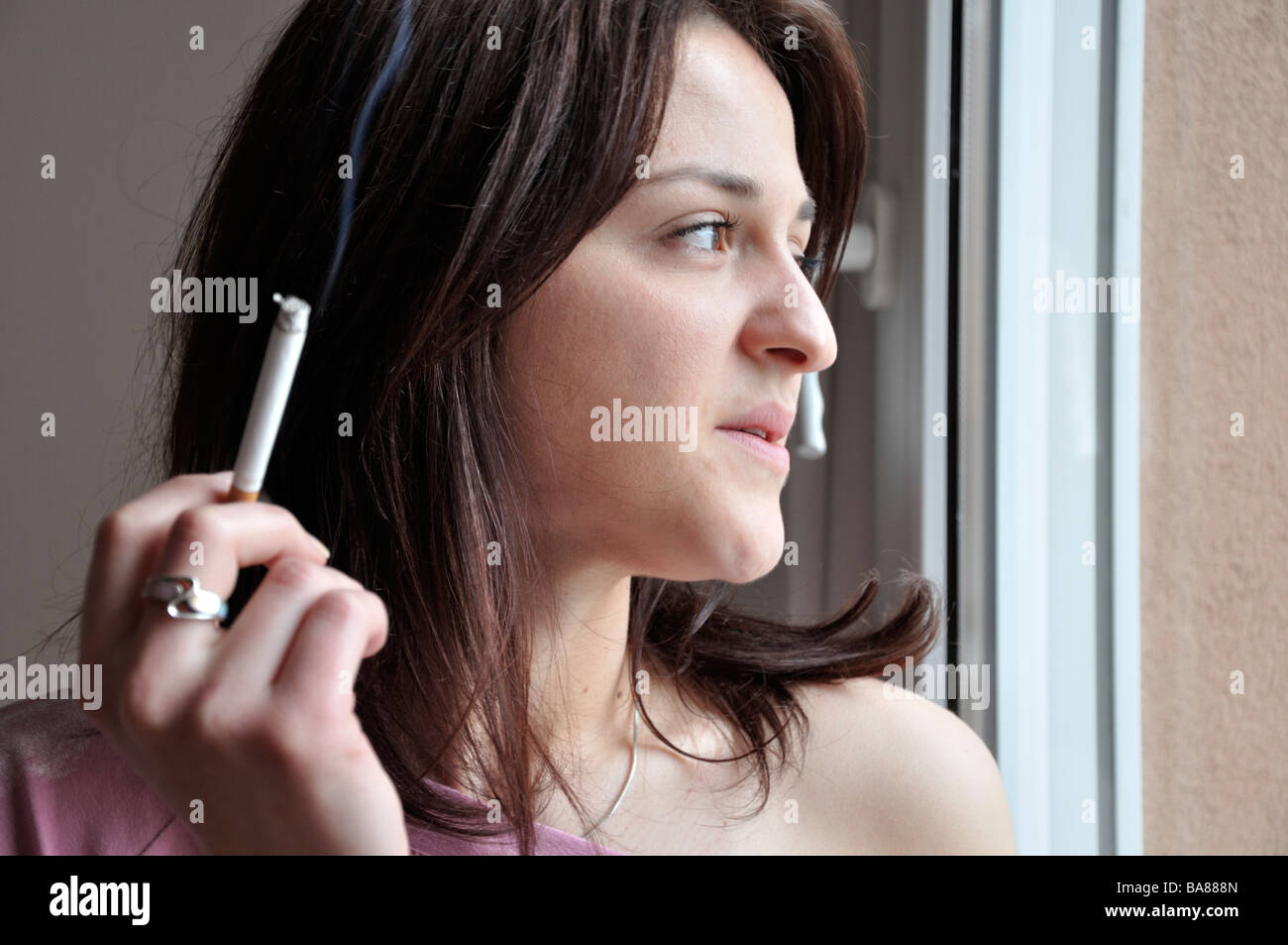 Young Woman Smoking Cigarette Inside High Resolution Stock Photography ...