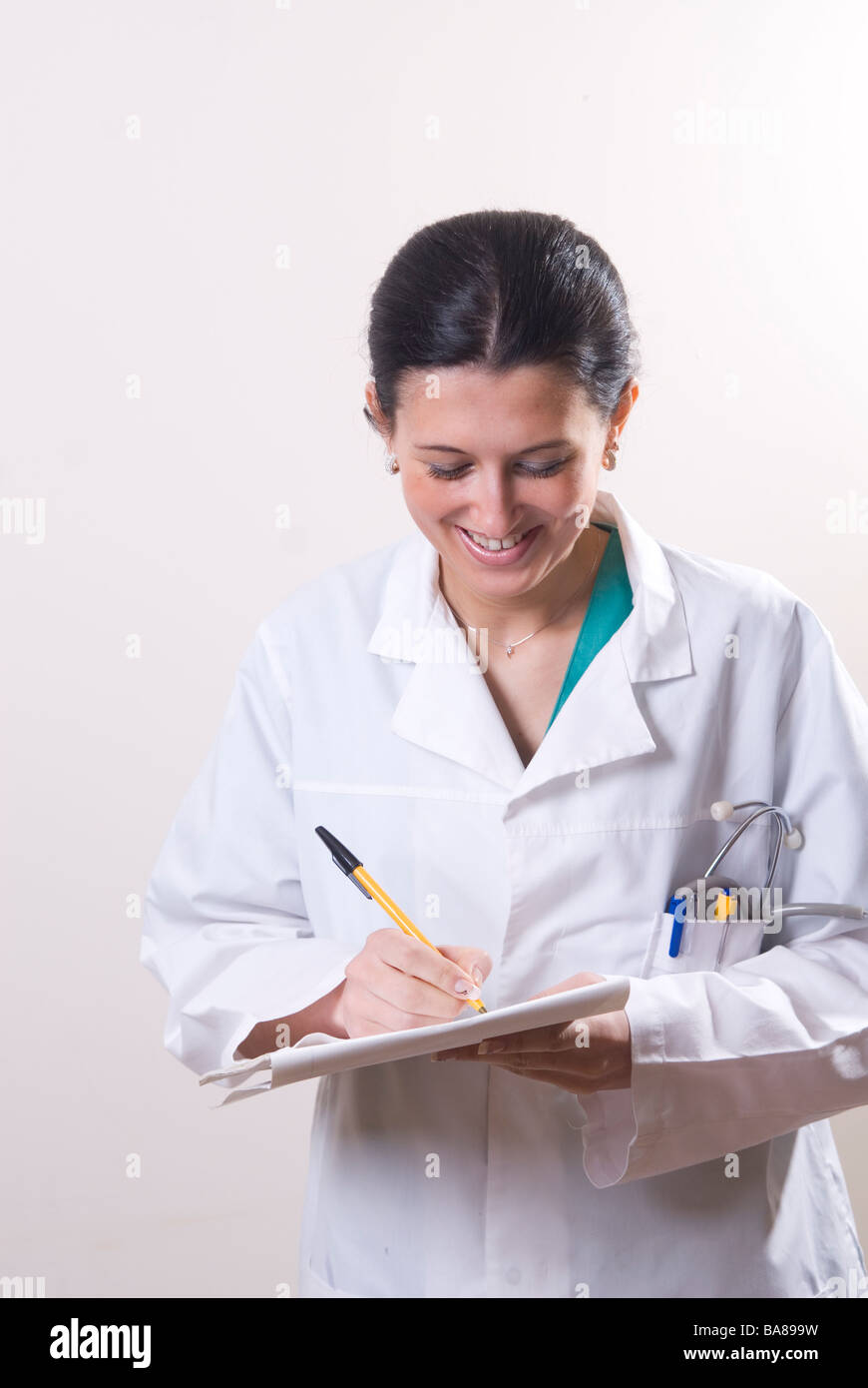 Doctor writing notes Stock Photo - Alamy