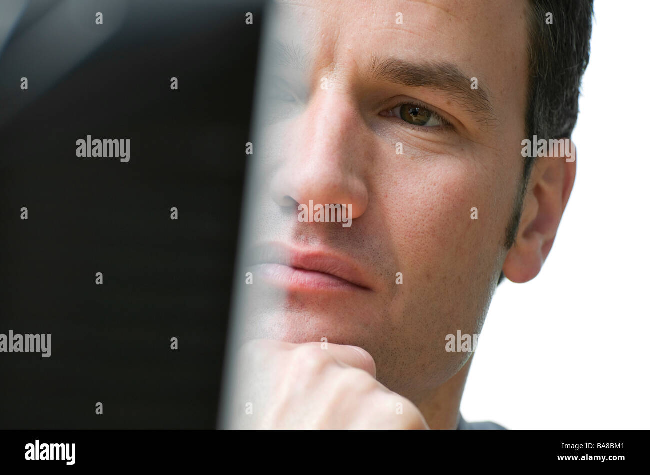 man looking at computer monitor Stock Photo - Alamy