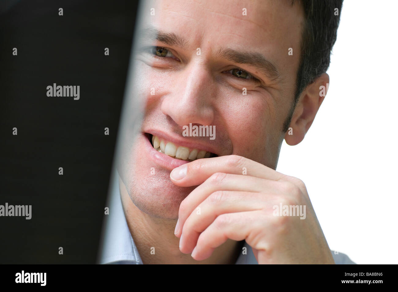 man looking at computer monitor Stock Photo - Alamy