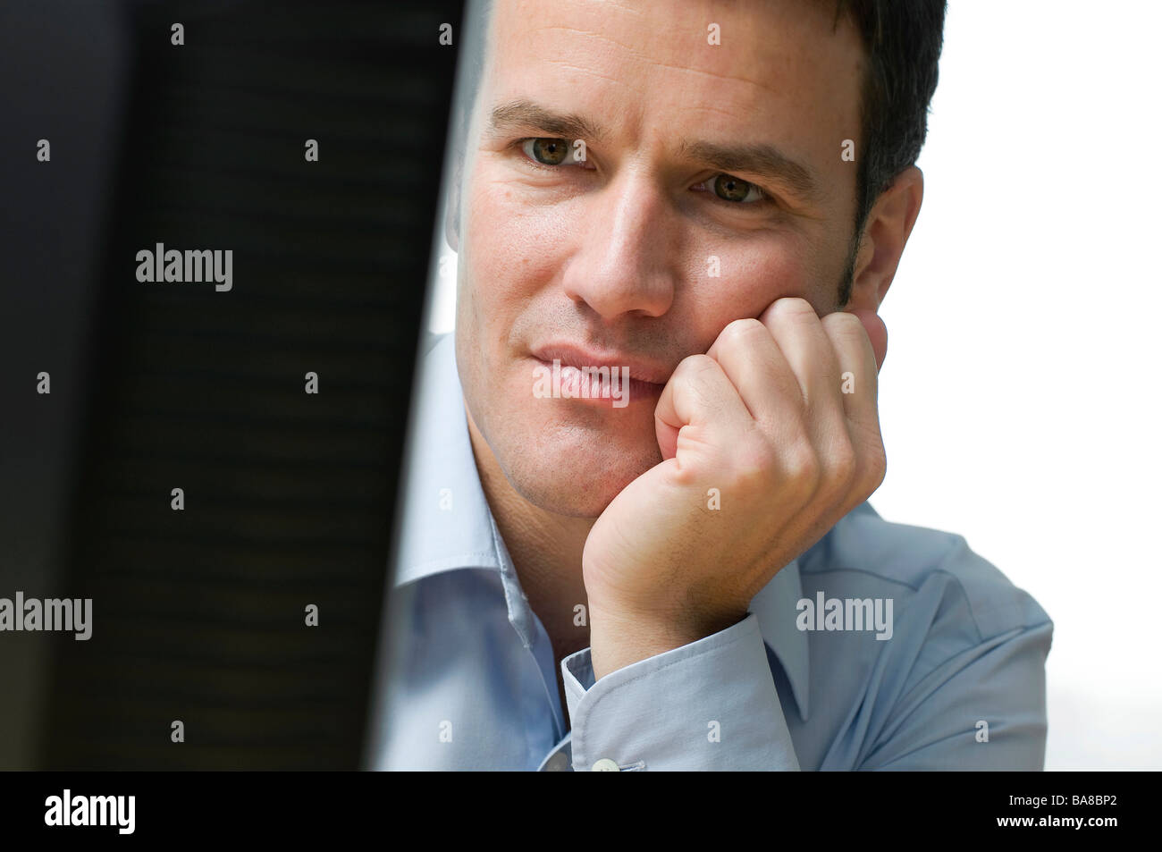 businessman, person looking at computer monitor Stock Photo - Alamy