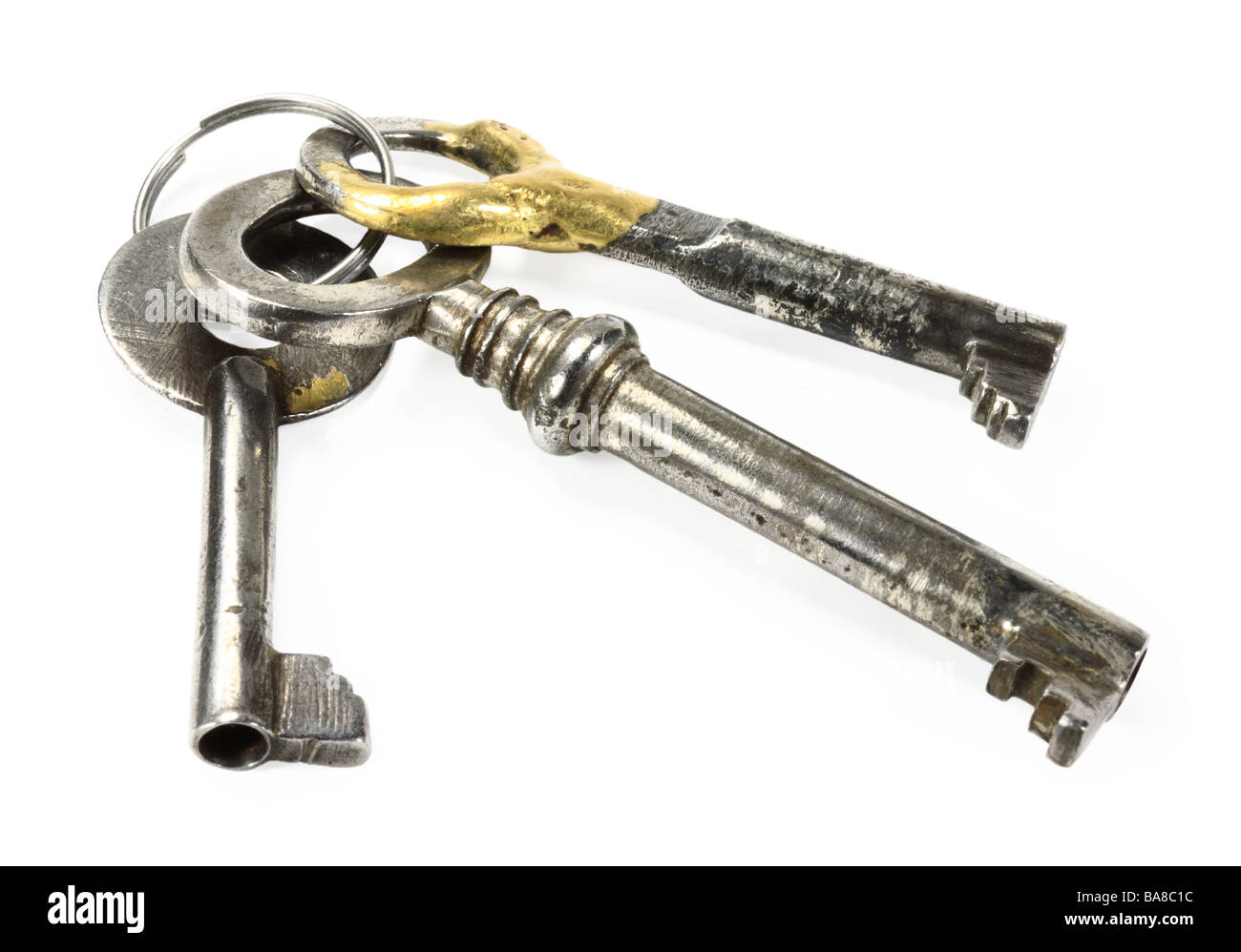 Three keys to an old wardrobe Stock Photo - Alamy