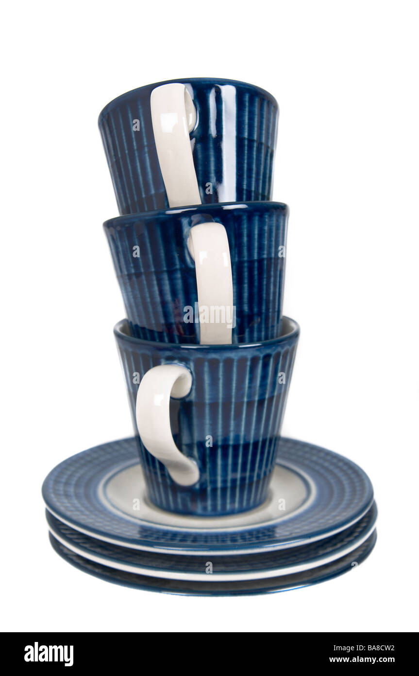 three blue teacups in a pile Stock Photo - Alamy
