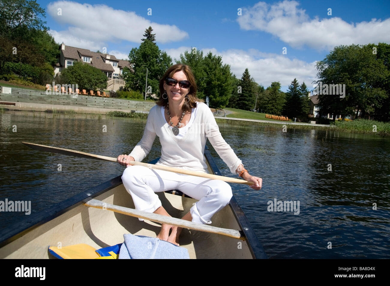 Muskokas, Ontario, Canada; Woman in a canoe Stock Photo - Alamy