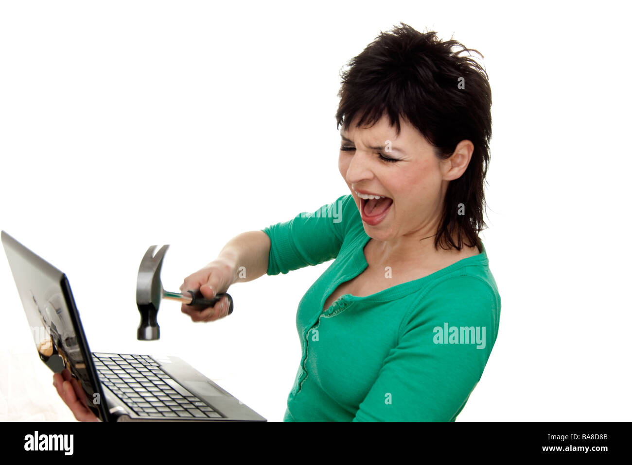 woman hitting a laptop computer with a hammer Stock Photo - Alamy