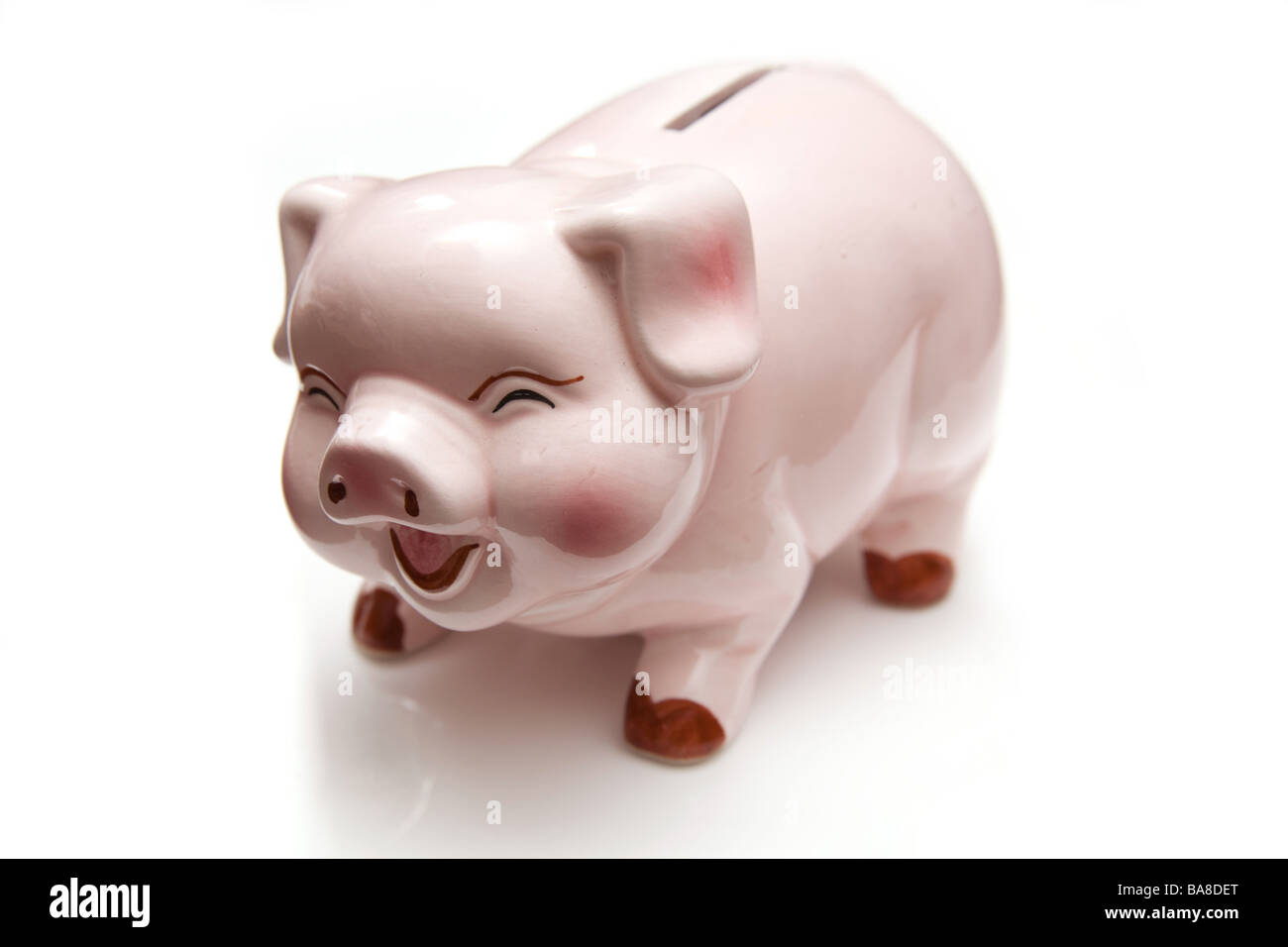 Piggy bank style money box isolated on a white studio background Stock ...