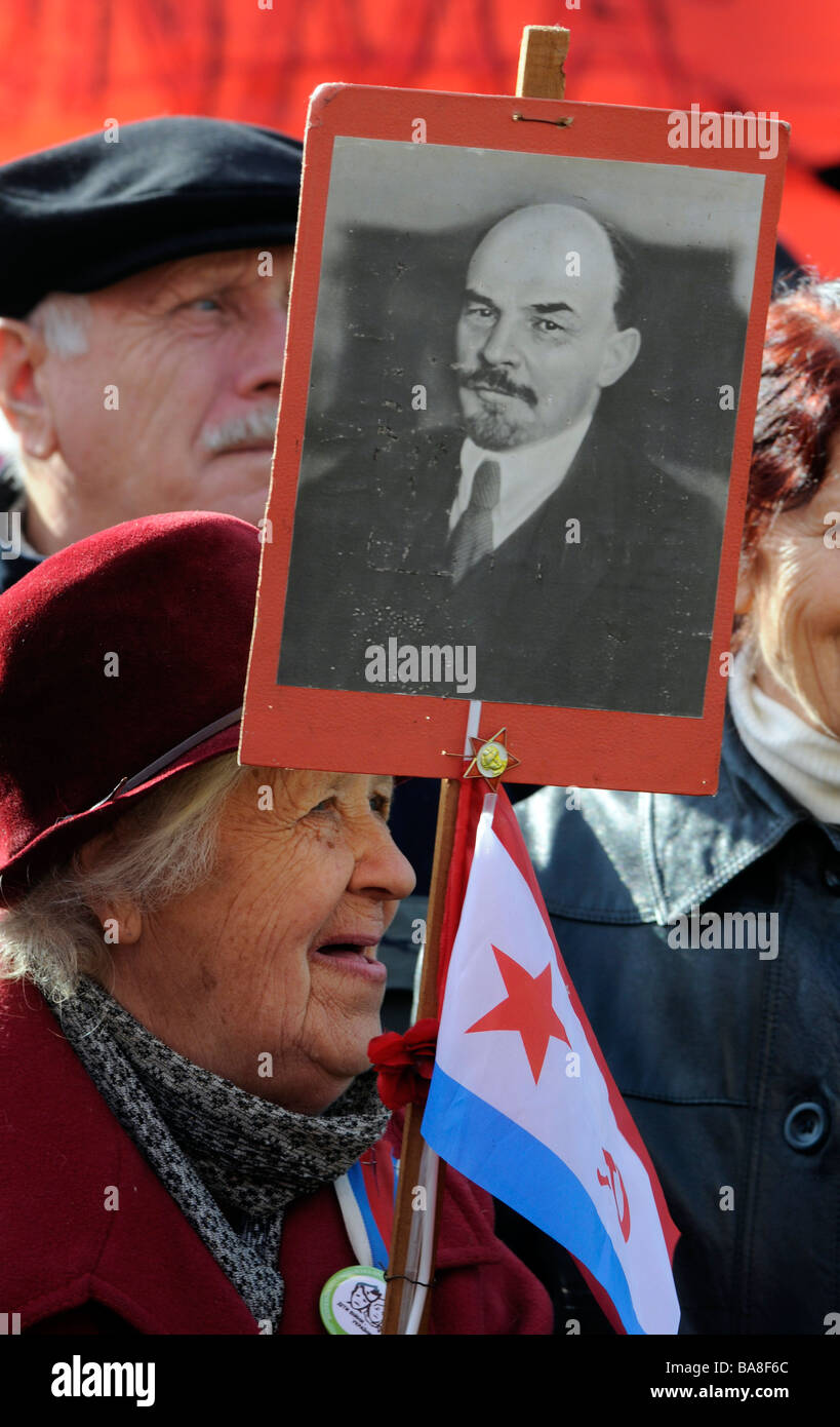 A Russian woman protest with a photo of Lenin, Communist leader and ...