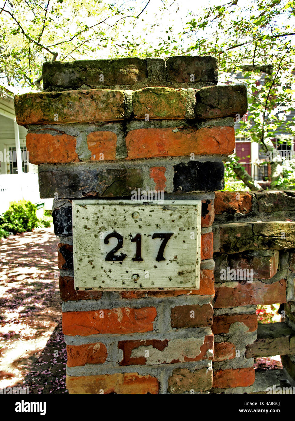 brick wall cornerstone with number 217 just below cap, multi-colored ...
