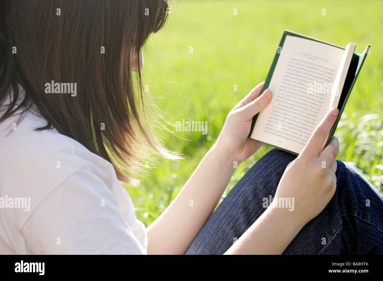 Reading a book Stock Photo - Alamy