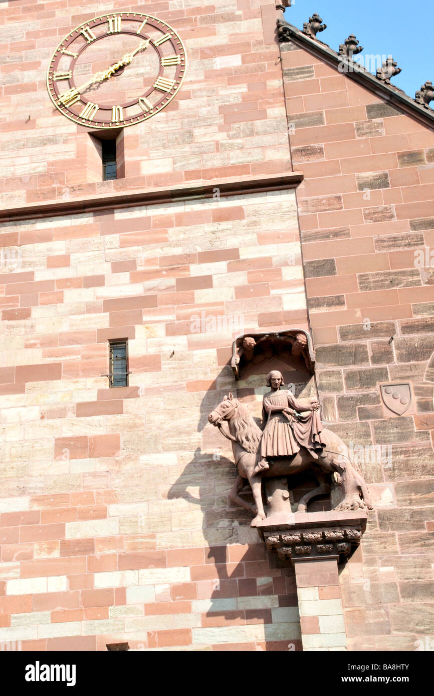Clock and statue on Basel cathedral tower Stock Photo - Alamy