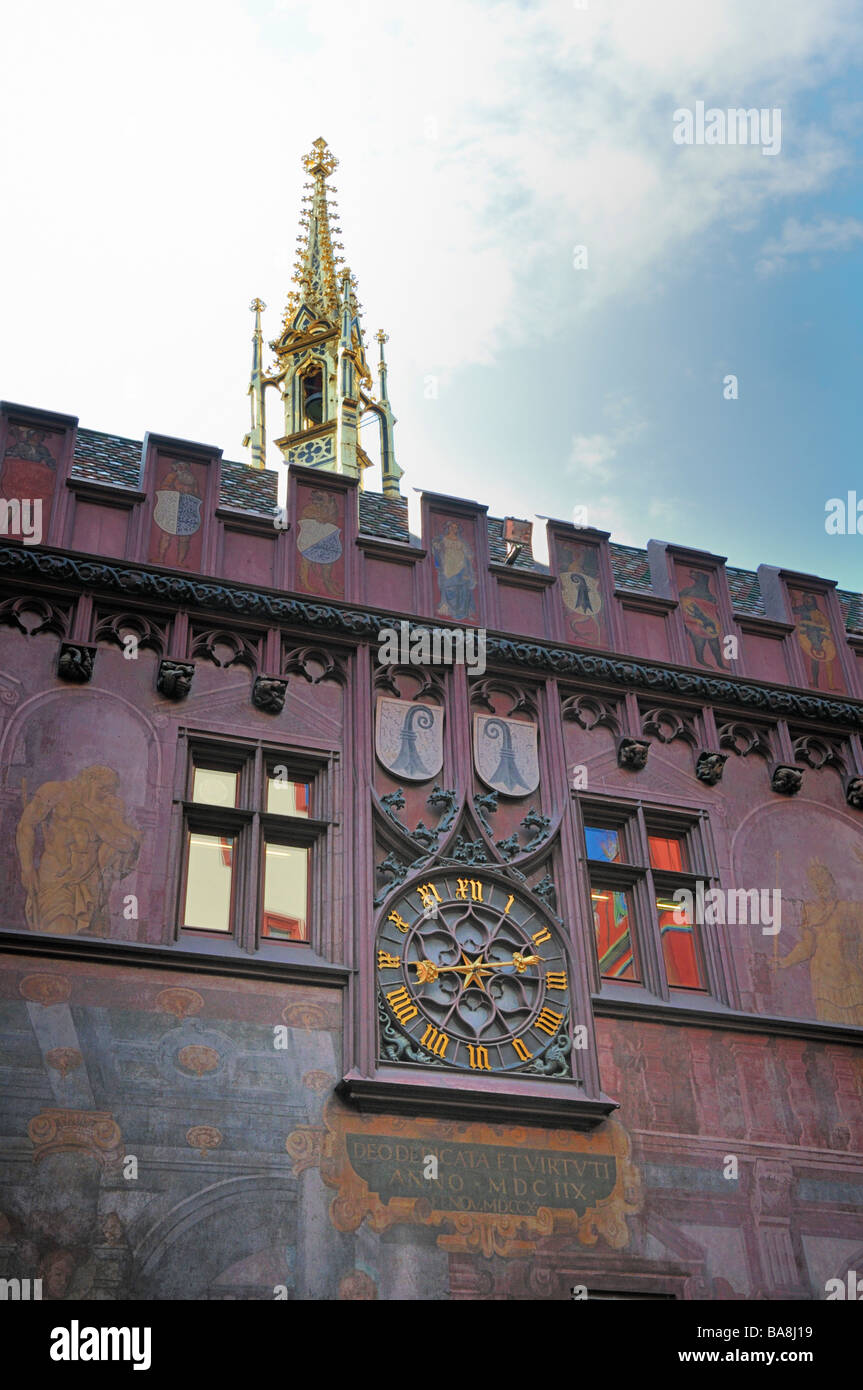 Section of the Basel town hall rathaus showing a clock and the symbol ...
