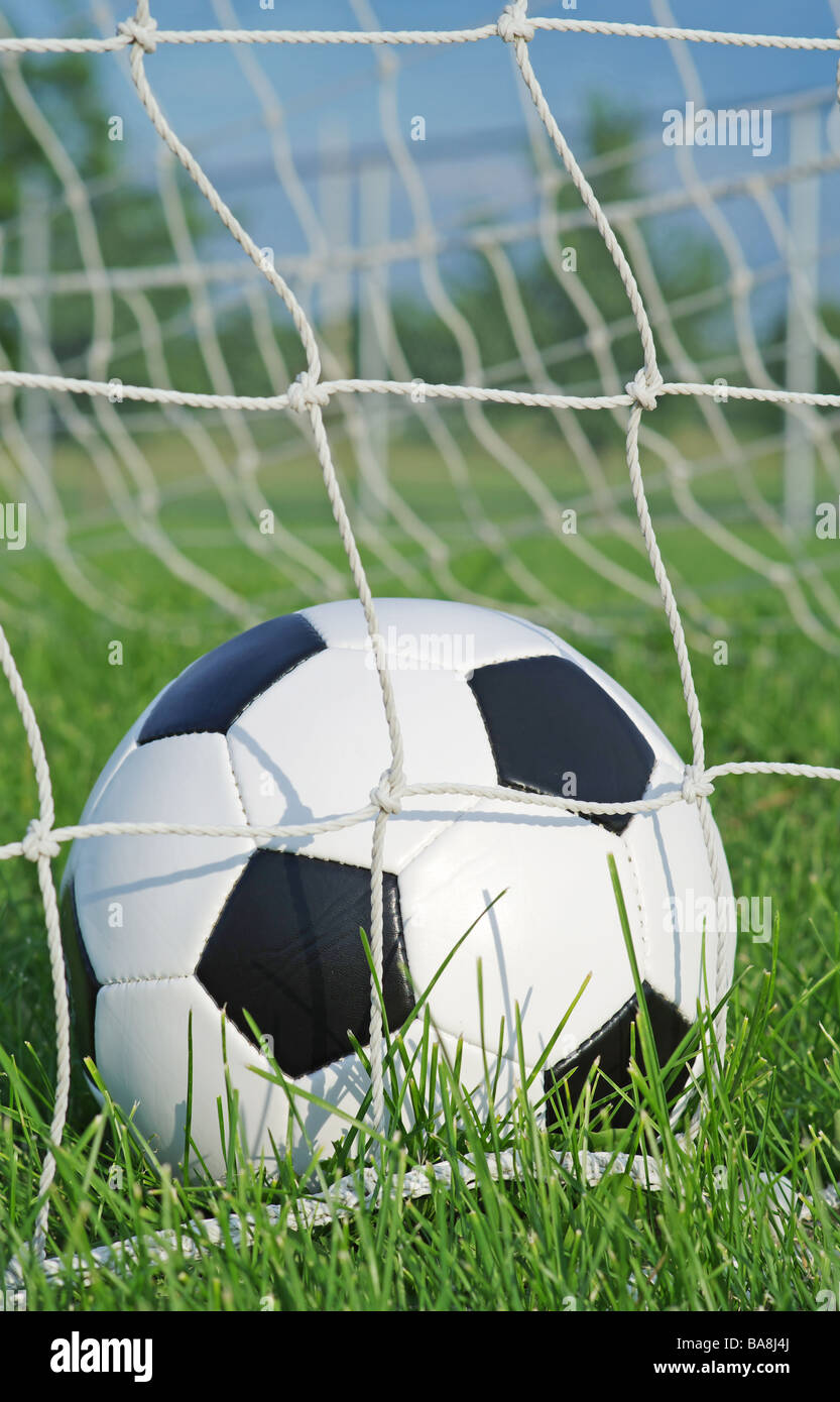 Soccer ball in the goal net Stock Photo - Alamy