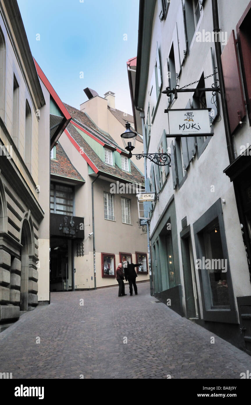 Men talking on a curving street in historic old Basel Stock Photo - Alamy