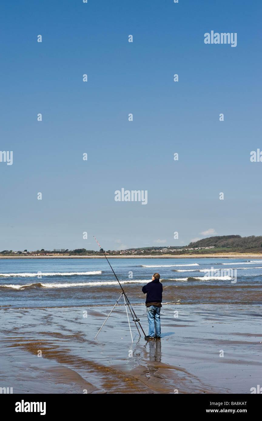Angler fishing on the Beach at Ogmore in Wales. Photo by Gordon ...