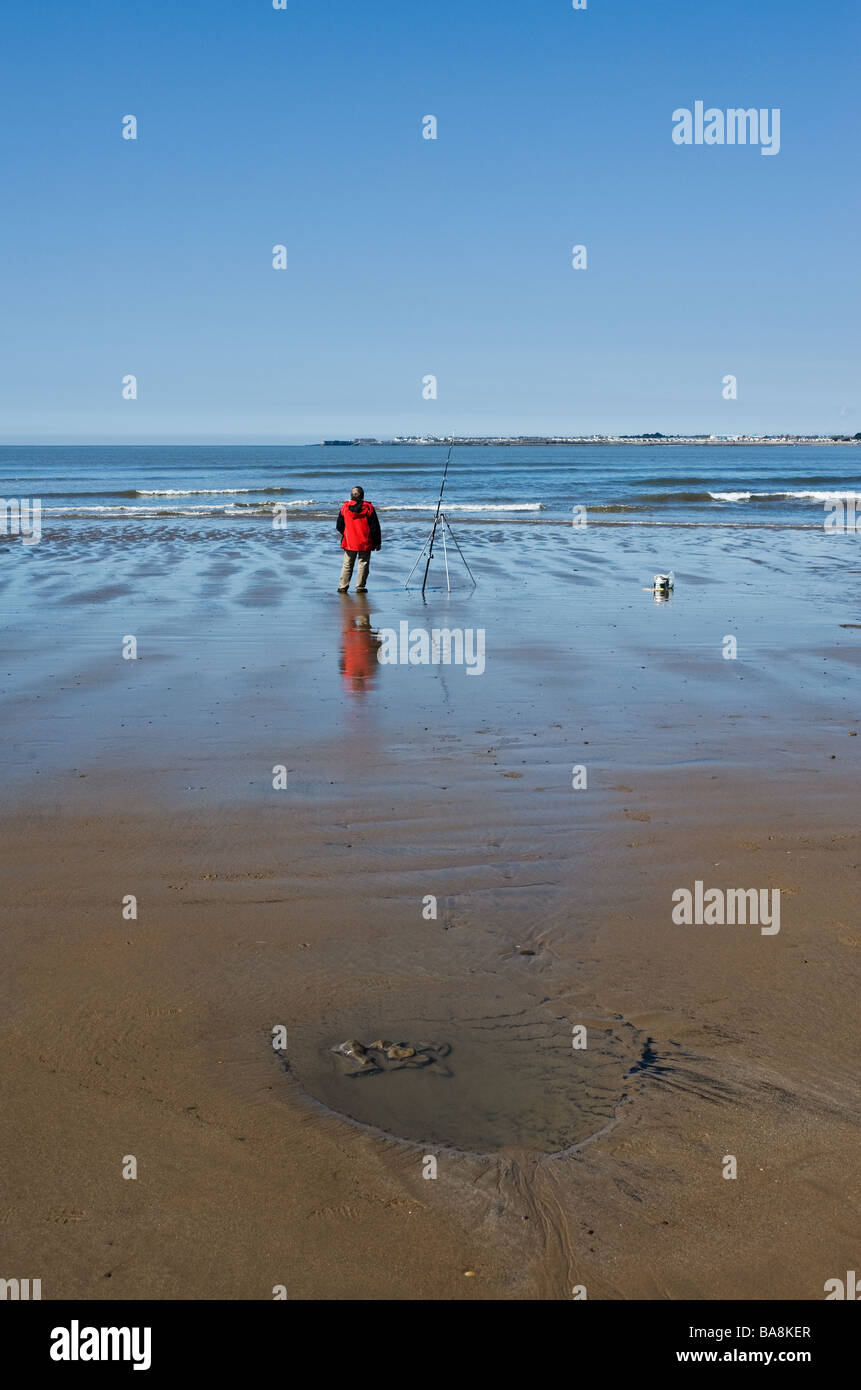 Fisherman angler fishing on beach hi-res stock photography and images ...