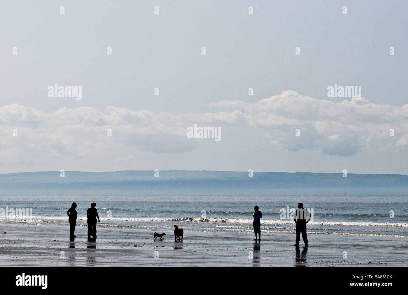People on the beach at Ogmore in Wales. Photo by Gordon Scammell Stock ...