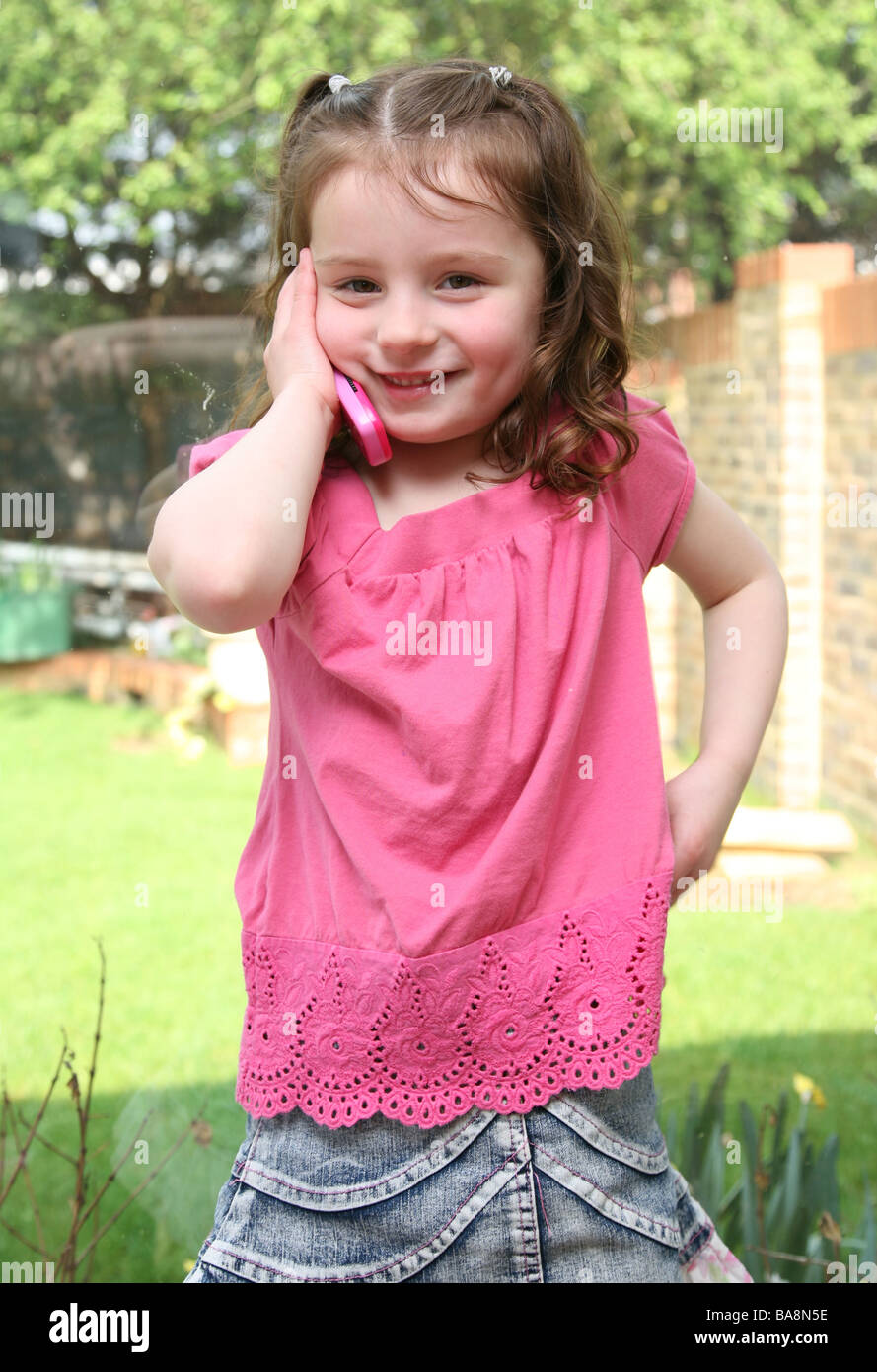 Child pretending to talk on a toy mobile phone Stock Photo - Alamy