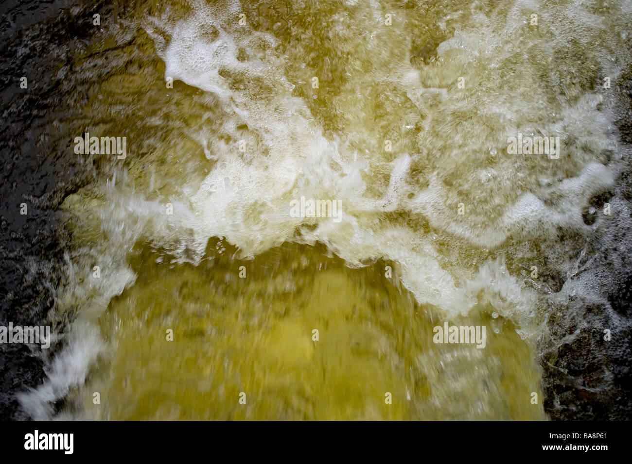 Water splashing over embankment Stock Photo - Alamy