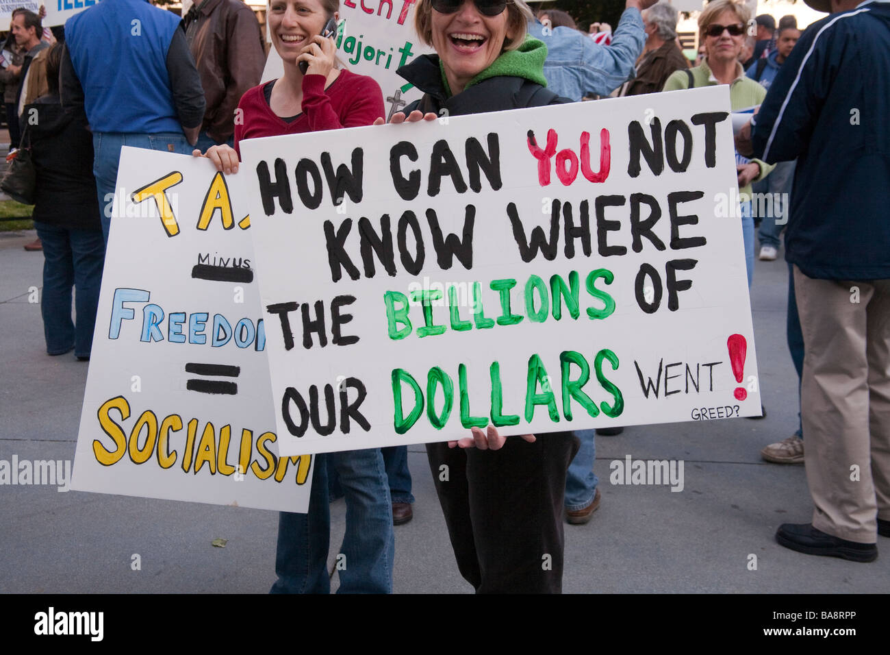 Women carrying political protest signs at San Jose Tea Party Stock ...