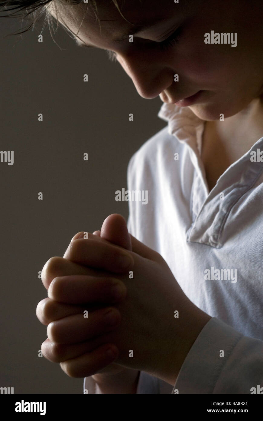 Young boy while praying Stock Photo - Alamy