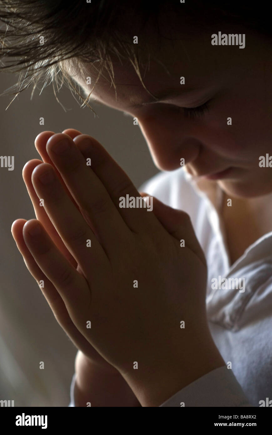 Young boy while praying Stock Photo - Alamy