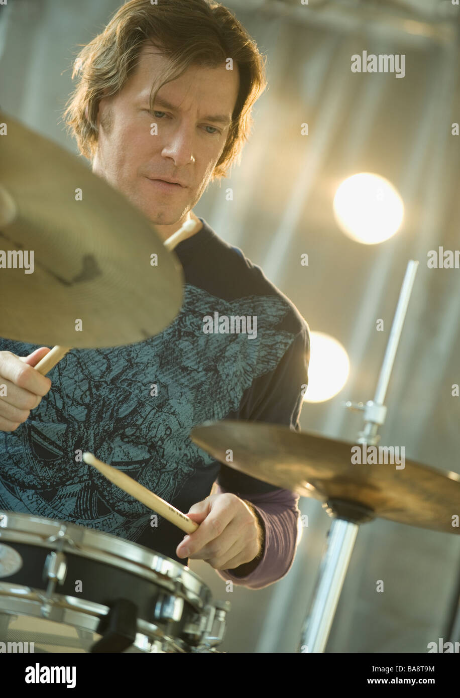Man playing drums Stock Photo - Alamy