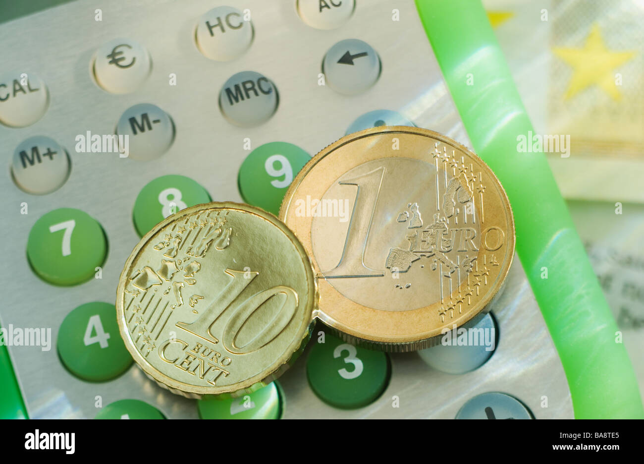 Calculator and euro coins Stock Photo - Alamy