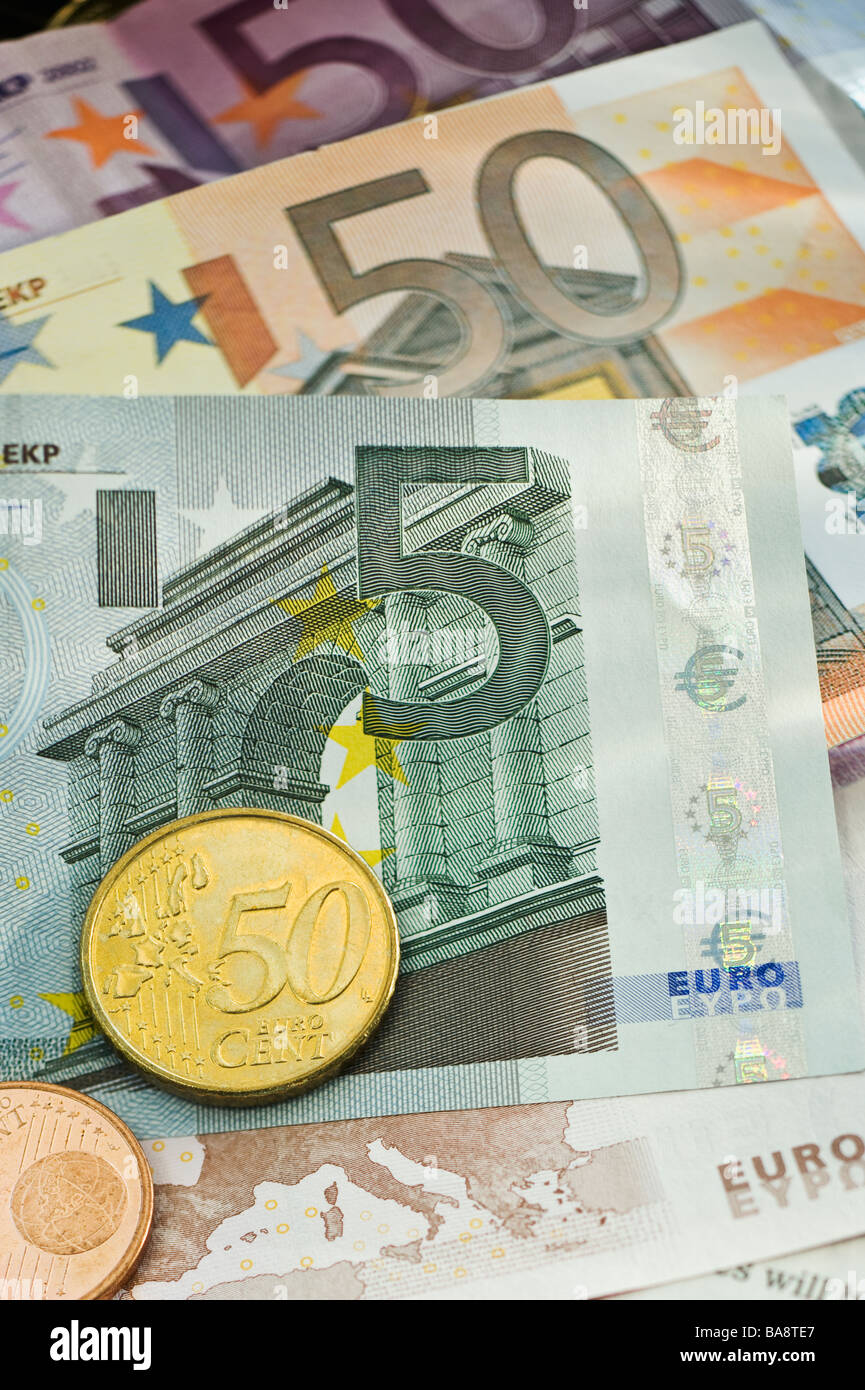 Assorted euro notes and coins Stock Photo - Alamy
