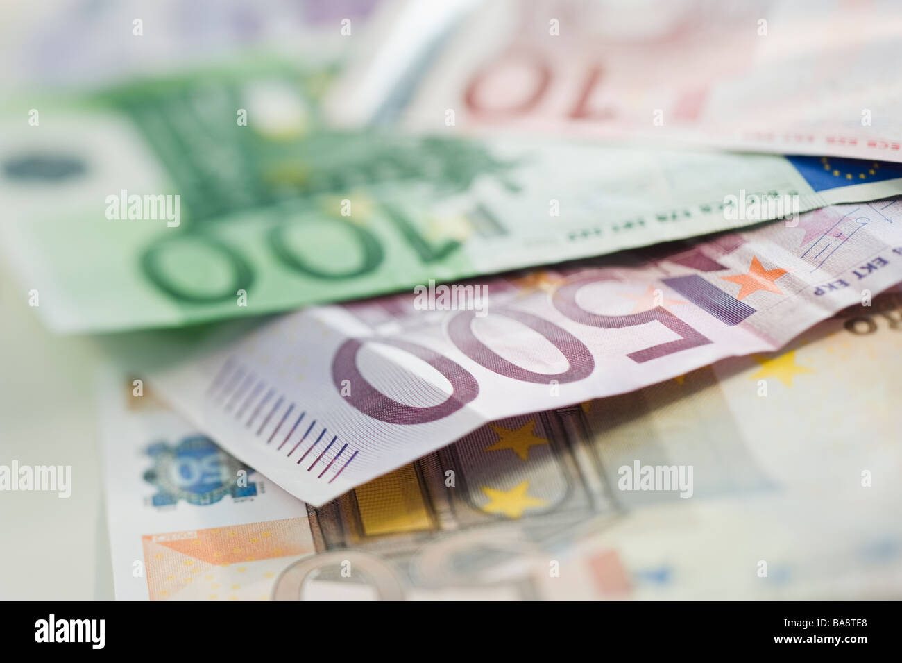 Assorted euro notes and coins Stock Photo - Alamy