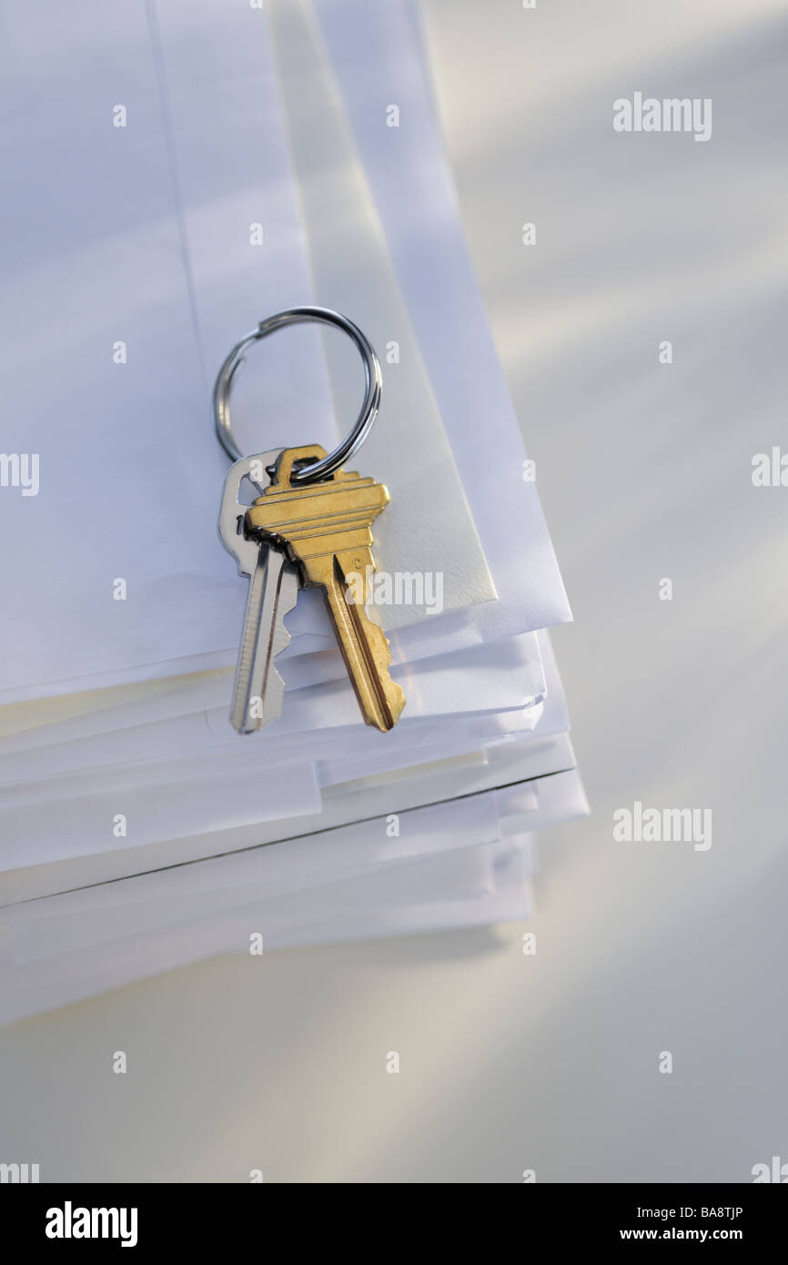 Keys on stack of mail Stock Photo - Alamy